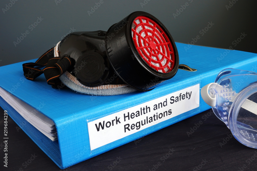 Work Health and Safety (WHS) Regulations on the desk. Stock Photo ...