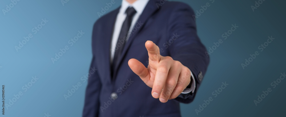 Businessman pointing finger Stock Photo | Adobe Stock