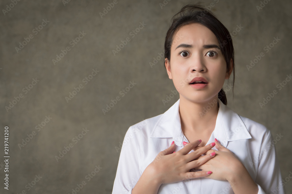 woman with shocking mood; portrait of shocked, stunned, fear, scared asian woman; asian 20s ...