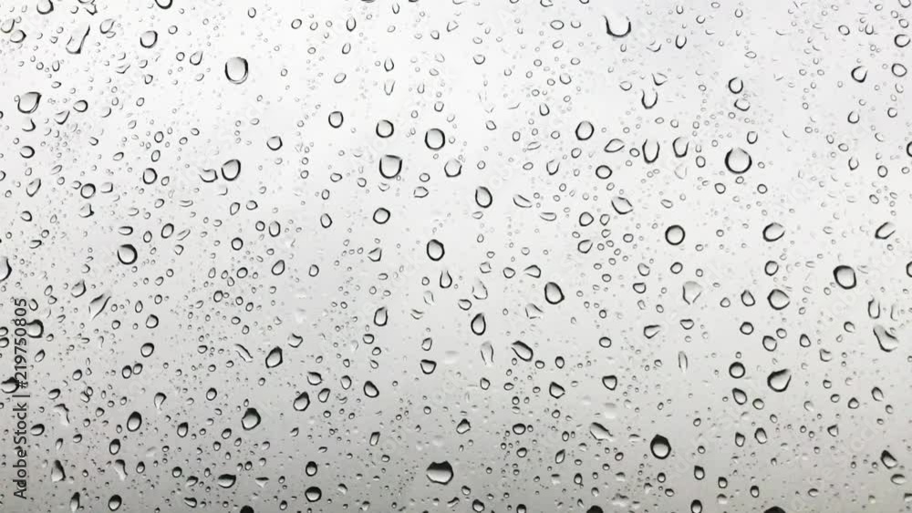 Close up image of raindrops falling on a window. Stock Video | Adobe Stock