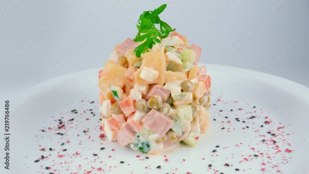 Classic Russian Olivier salad, served in restaurant, boiled vegetables ...