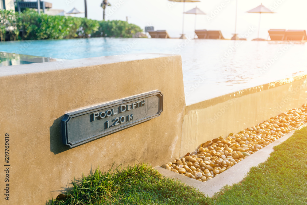 warning pool depth sign by swimming pool in modern resort for safety in ...