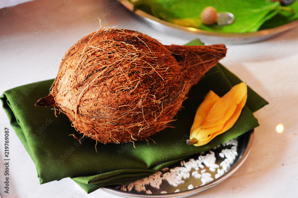 Coconut rice and flowers green cloth for Hindu pooja India ceremony ...
