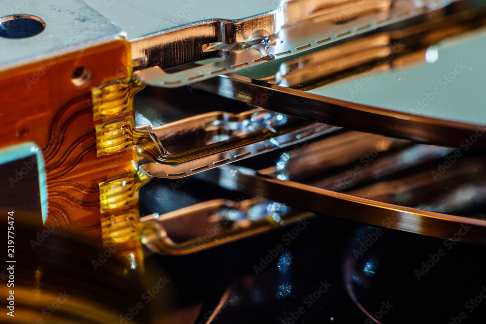 Hard disk drive inside electronic parts and plates. Repair of computer ...