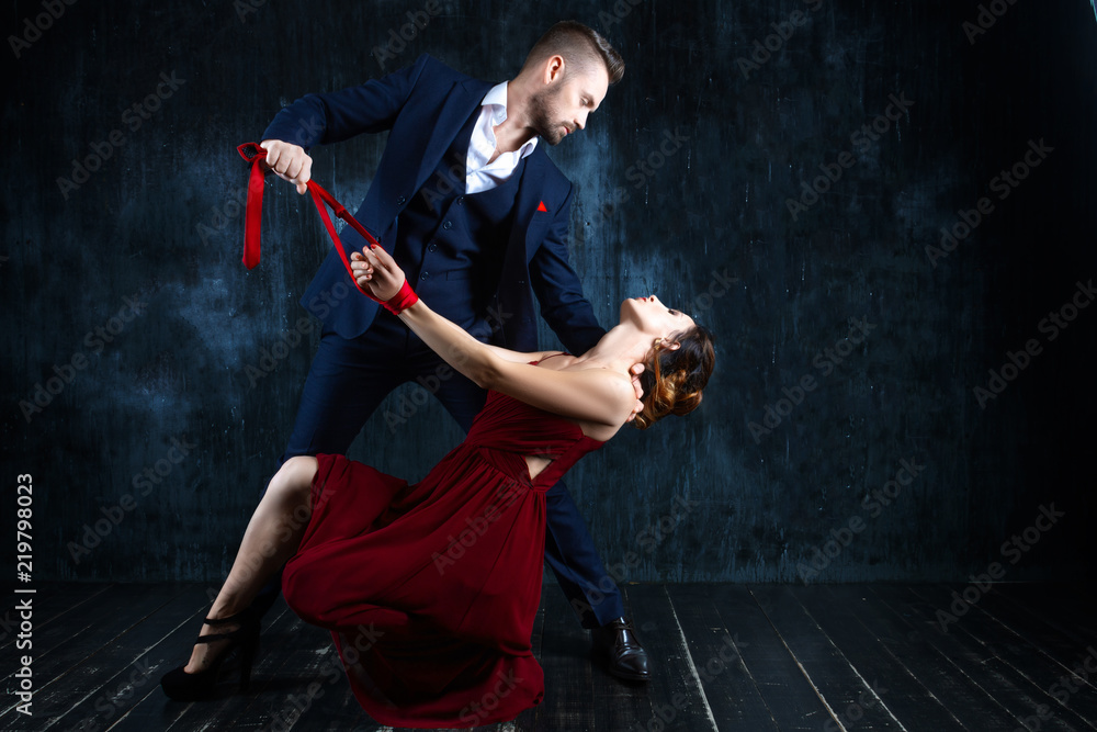 Couple in dating. Rich man male dress skirt tying woman hands. Woman ...