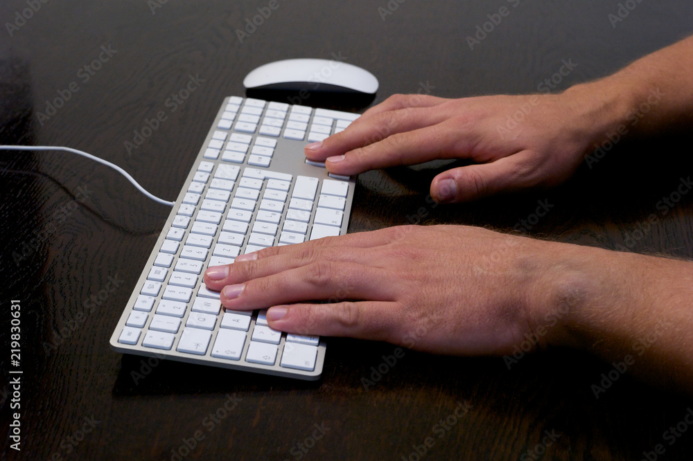 Foto de Working with a Computer - Typing Hands using Arrow Keys on Desk ...