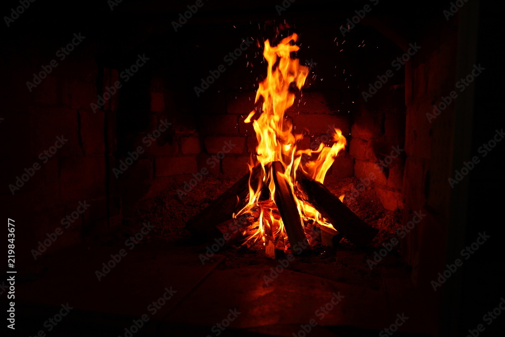 fire in a brick fireplace/ fire in a brick fireplace, flames are ...