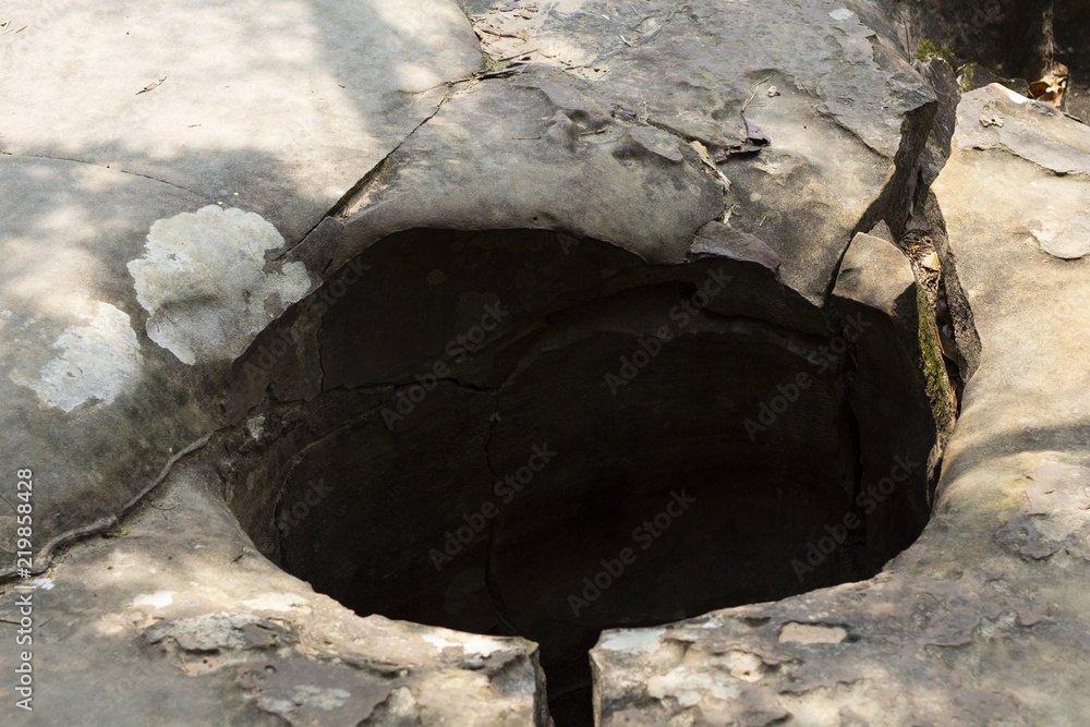 Water hole in solid rock, natural landscape formation. Geological ...