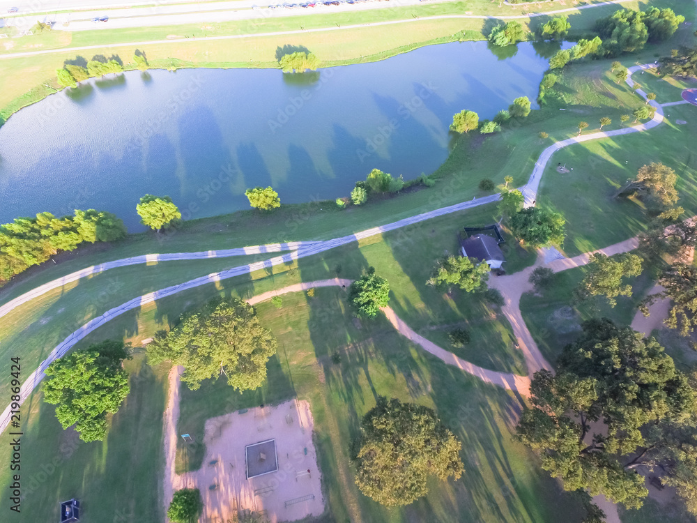 Aerial urban lakeside green park in suburban area Houston. Trees ...
