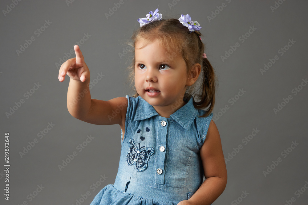Cute little girl touching screen. Funny child girl pressing button on ...