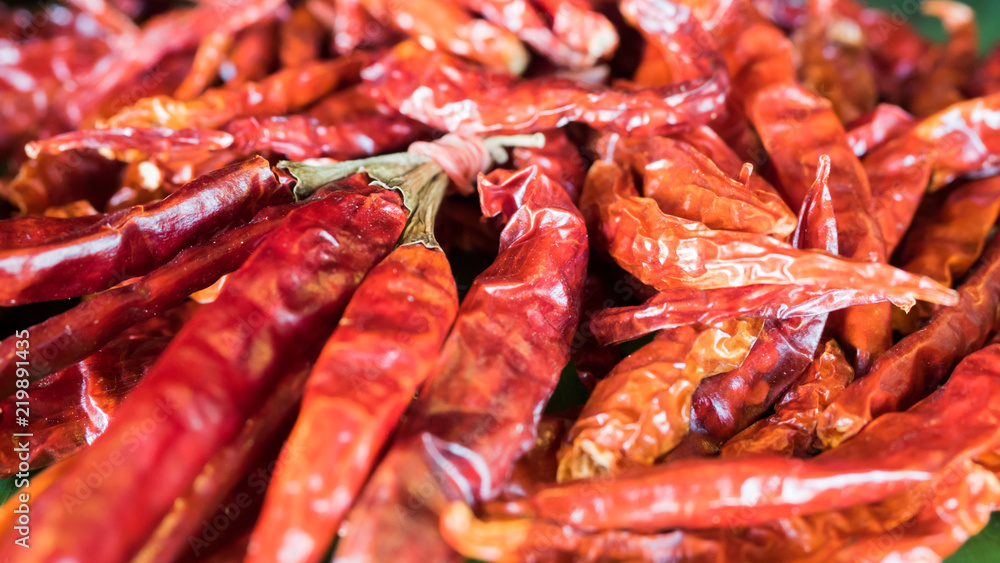 Fried dried chilli pepper Pile of dried chilli on sale in the market ...