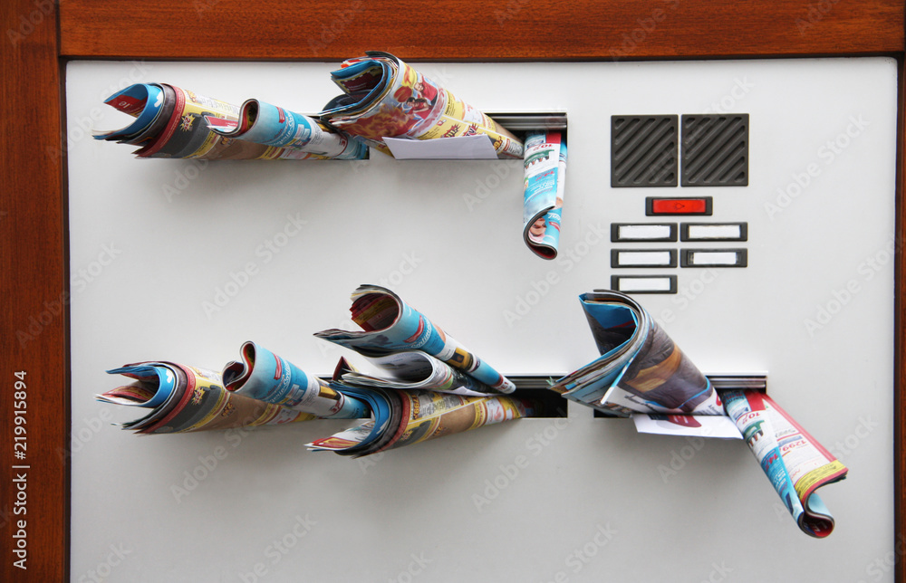 color promotional magazines and letters in post boxes - delivering ...