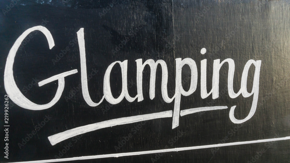 Glamping sign at a campsite in Pembrokeshire near Tenby in South Wales ...