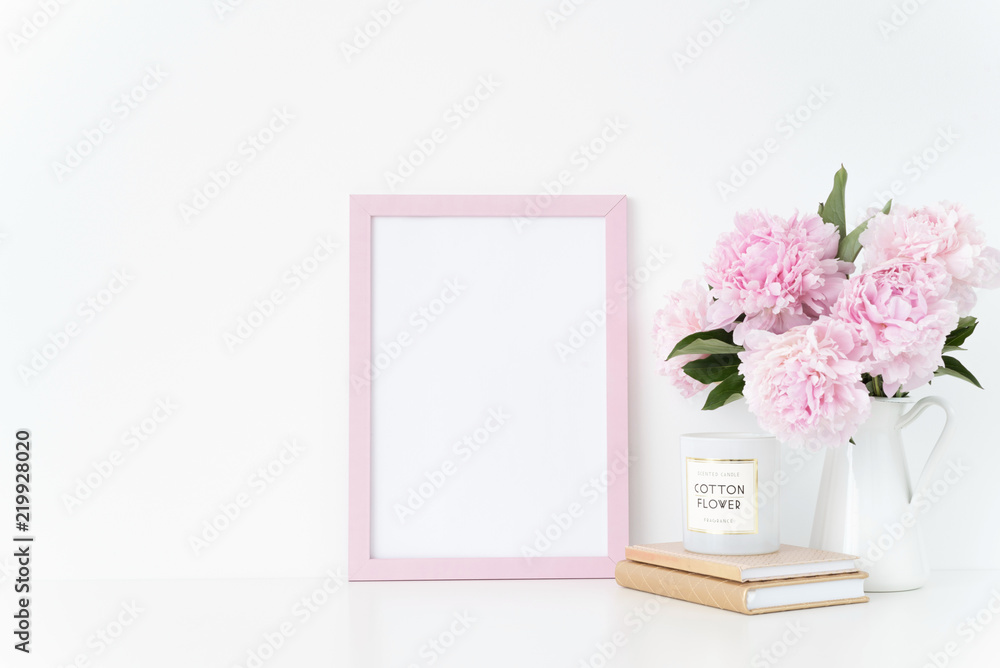 Cute pink portrait a4 frame mock up with a pink peonies in jug beside ...