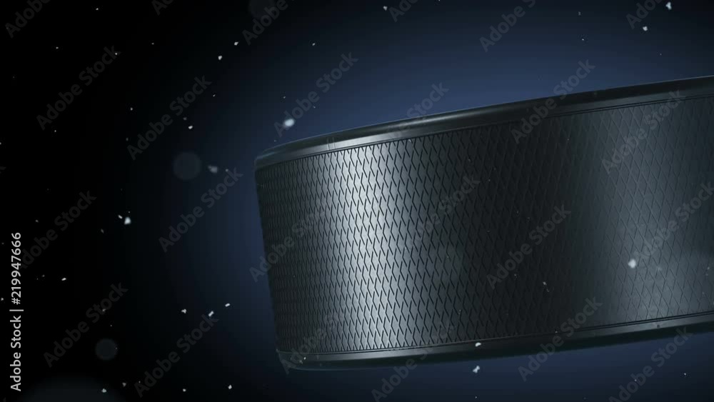 Beautiful Hockey Puck Rotating Close-up with Snow Flakes Flying Around ...