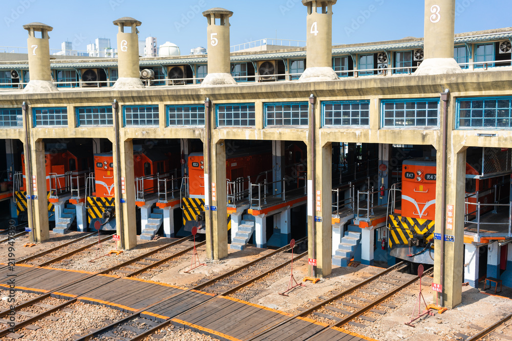 Trains parked in fan-shaped train garage at railway roundhouse in ...
