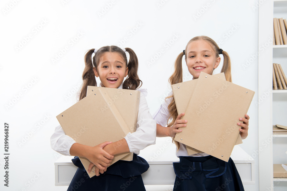 Small girls prepare for future profession in office. Happy small girls ...