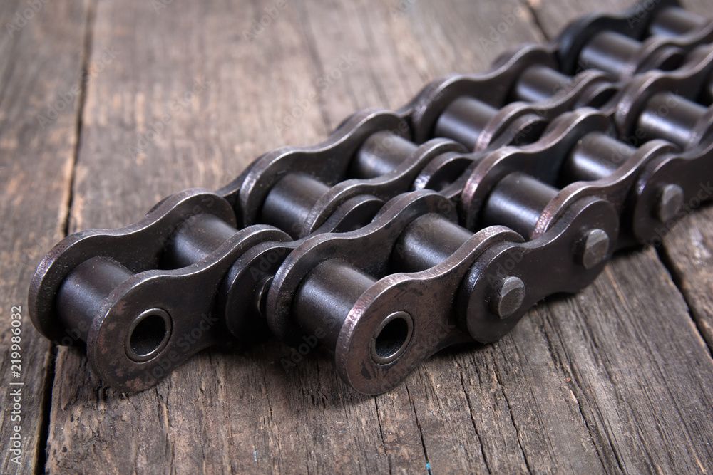 Industrial driving roller chain. Part of the chain drive of machine ...