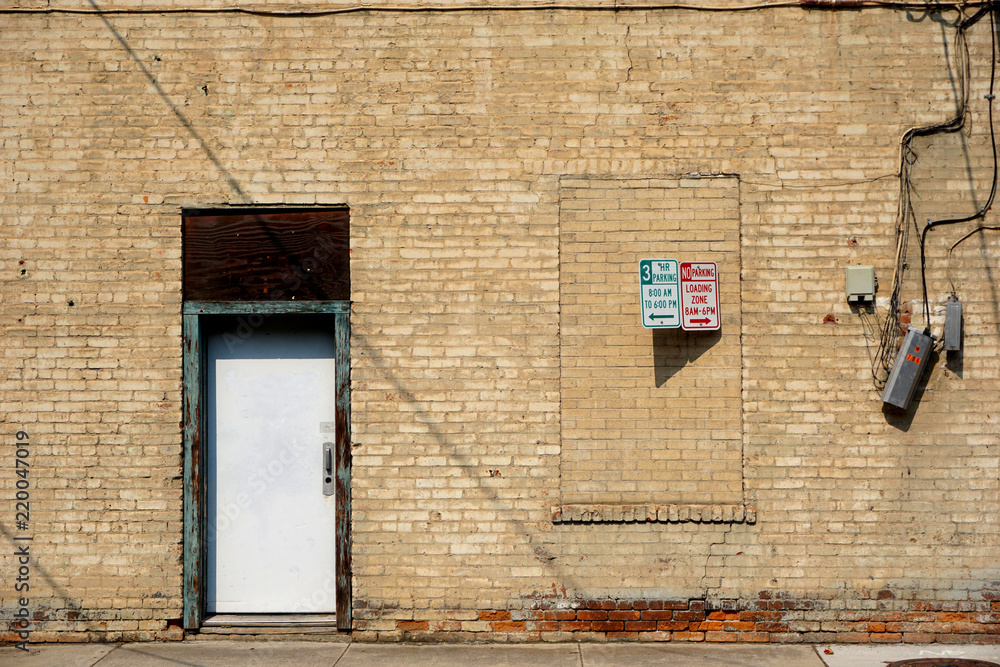urban back alley wall with door and electrical wires Stock Photo ...