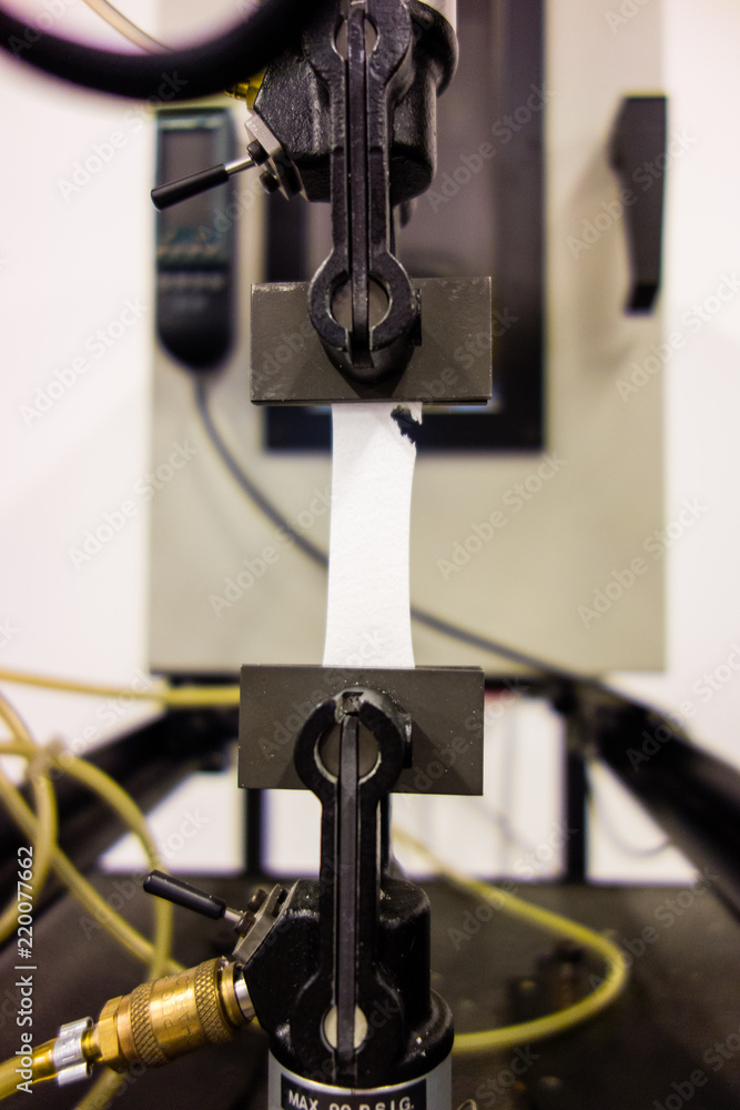 Sample in the mechanical tensile tension machine Stock Photo | Adobe Stock
