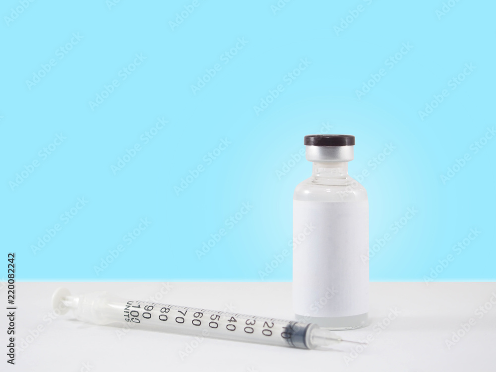 Blank label medical glass vial and plastic syringe for injection on ...