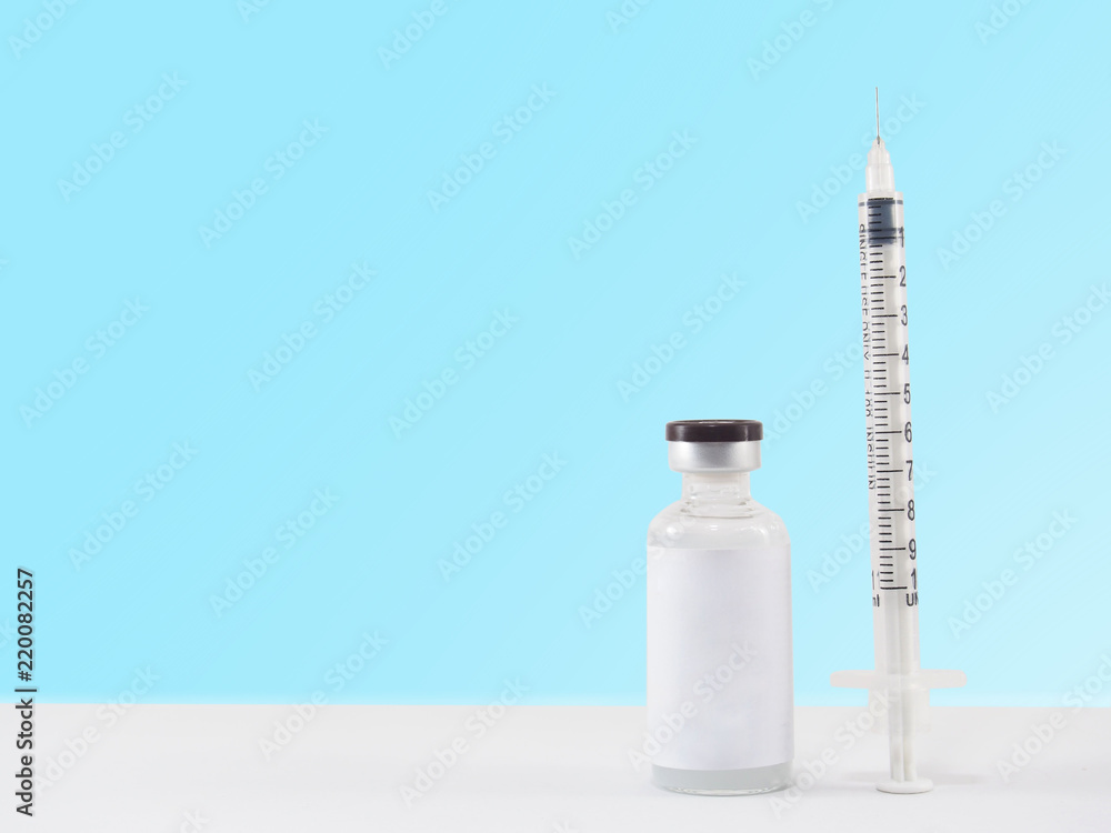 Blank label medical glass vial and plastic syringe for injection on ...