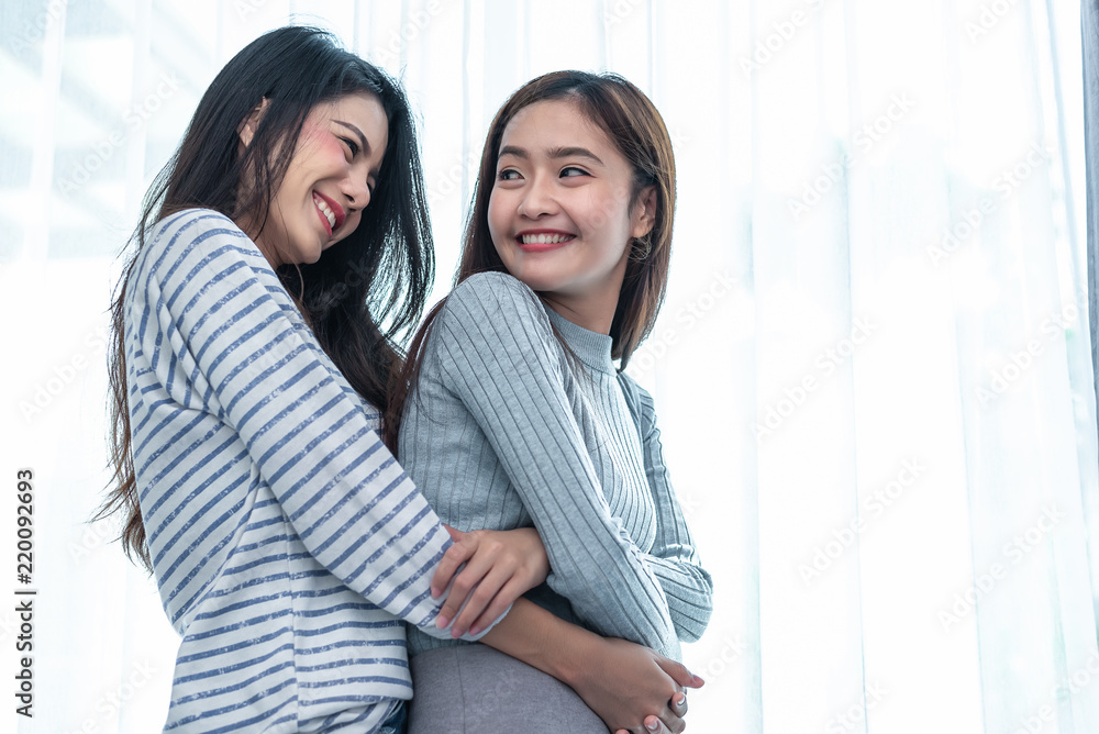 Two Asian Lesbian Women Hug And Embracing Together In Bedroom Couple