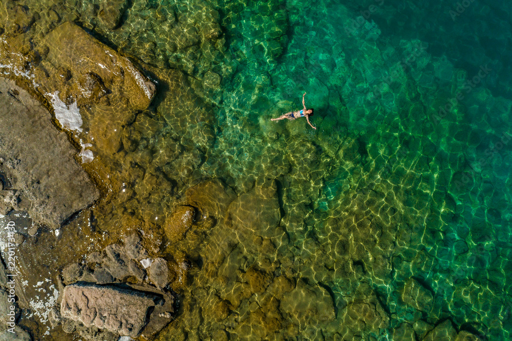 girl floating in the water, top view Stock Photo | Adobe Stock