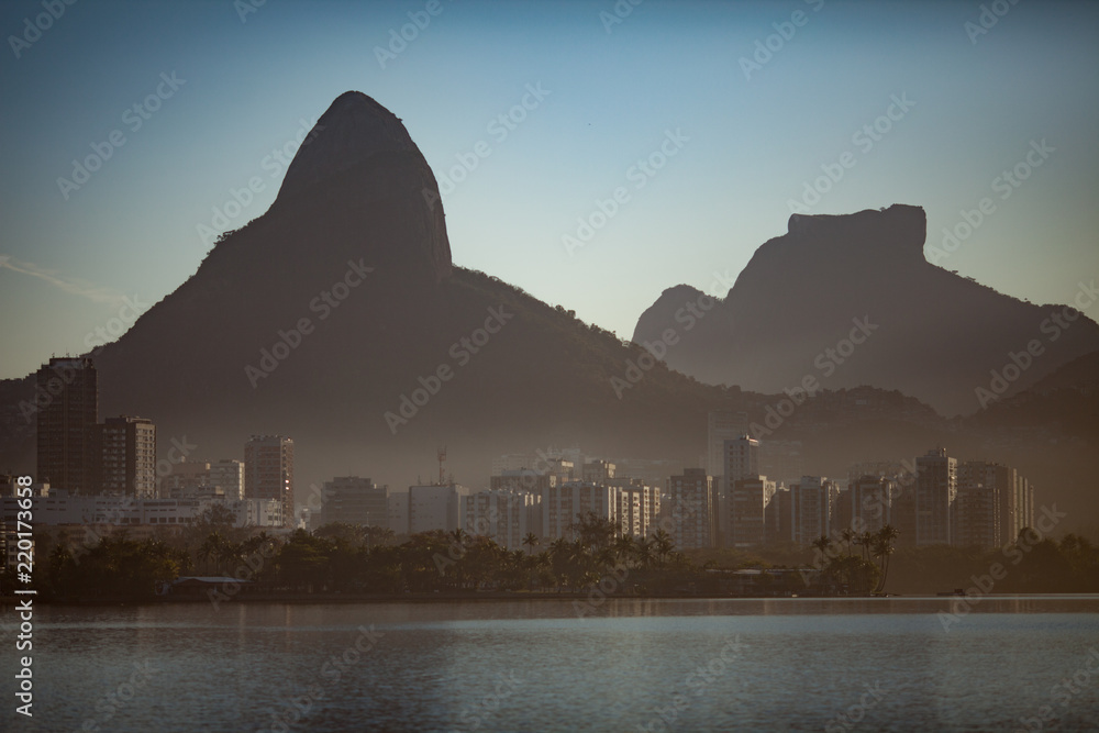 Hazy sunset at the city lake of Rio de Janeiro with recognisable ...
