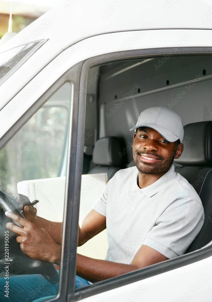Foto de Courier Delivery. Black Man Driver Driving Delivery Car do ...