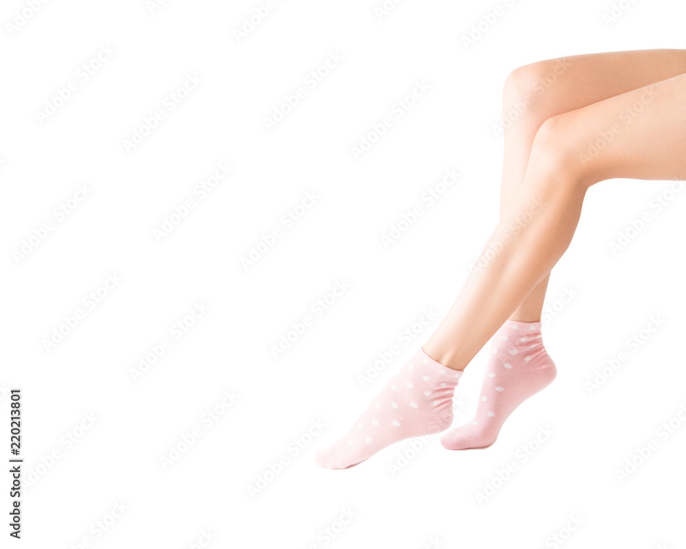 well-groomed female feet in pink socks, side view, isolated on white ...