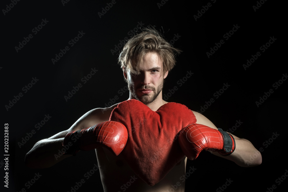 Man in love, broken heart. Boxer's heart. Attractive man in boxing red ...