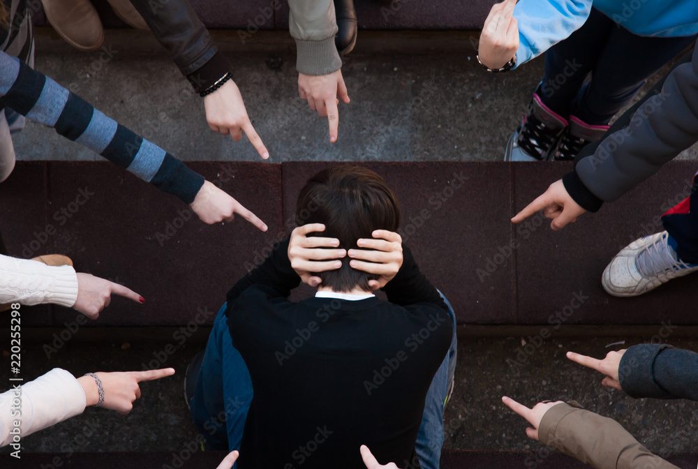 a lonely sad kid being bullied from his mates. A bullying scene in ...