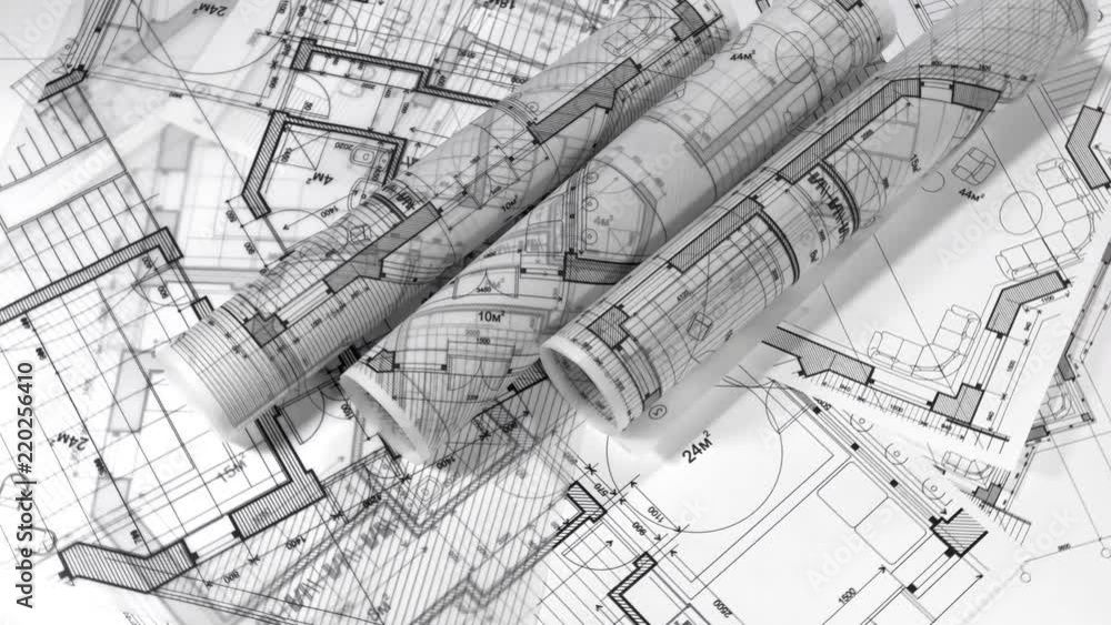 Blueprints - rolls of architectural drawings smoothly rotate on the ...