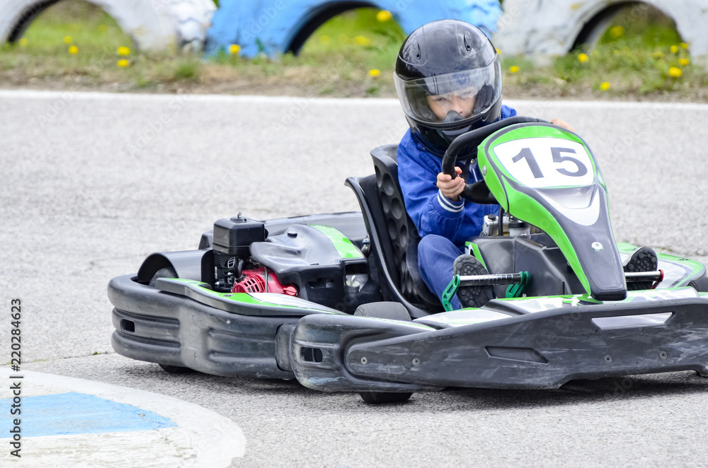 Karting - driver in helmet on kart circuit Stock Photo | Adobe Stock