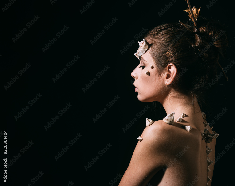Woman with thorns on skinny back and shoulders fantasy creature ...
