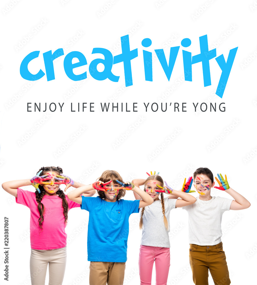 schoolchildren having fun and showing painted hands with smiley icons ...