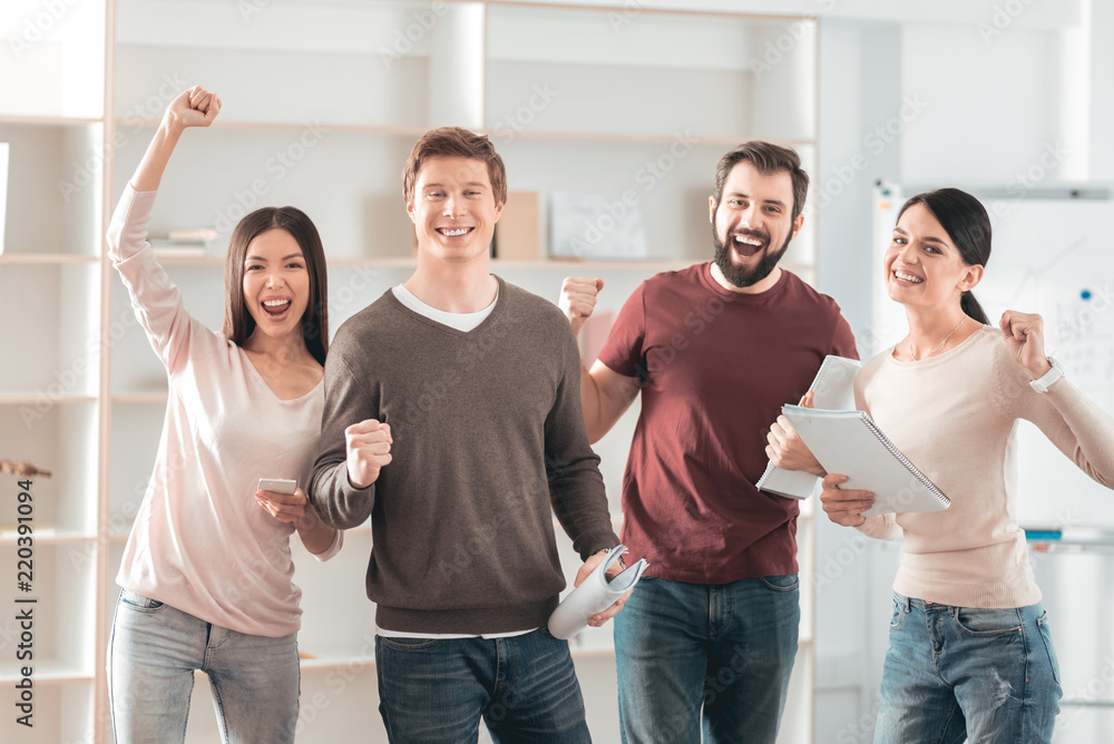 We are the leaders. Joyful young student feeling happy while being the ...