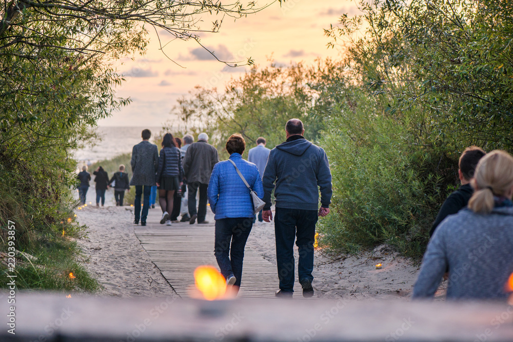 Romantic bonfire night at seaside during sunset. People gathering ...