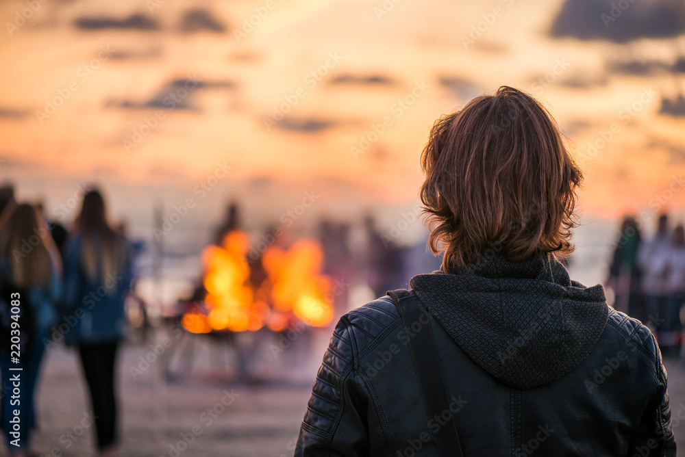 Lonely young man looking at the sunset and waiting his love. Romantic ...