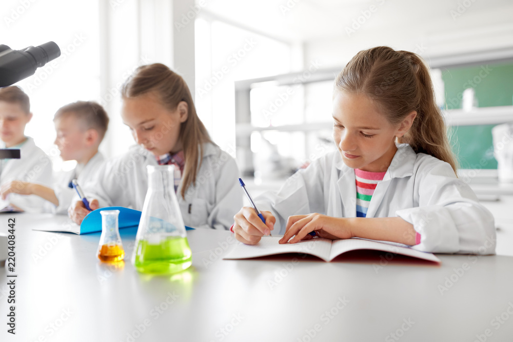 education, science and children concept - kids studying chemistry at ...