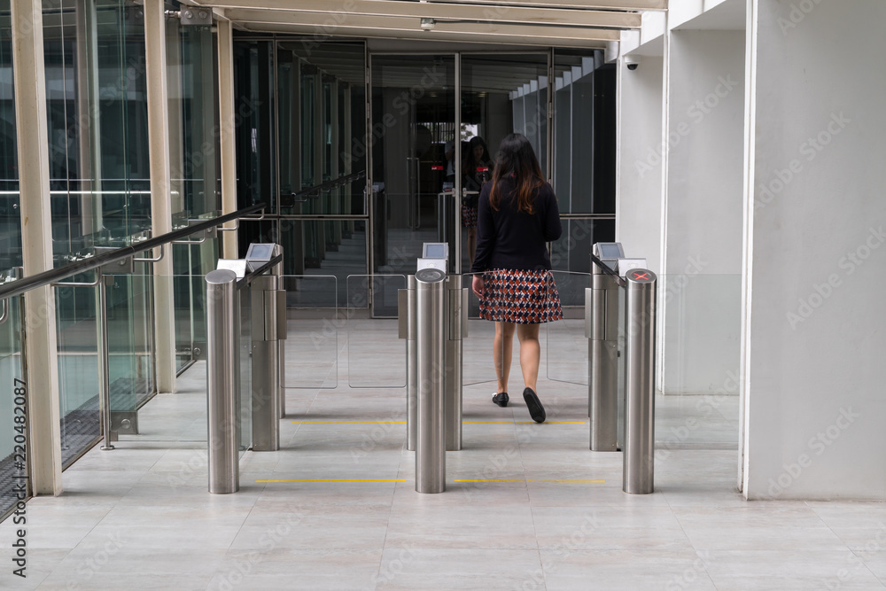 women walking to entrance gate security with key card access control ...
