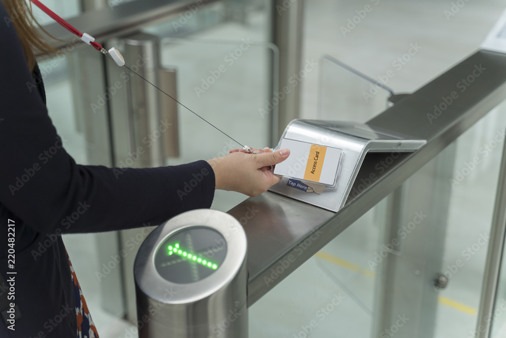 women holding key card access control to unlock security at an entrance ...