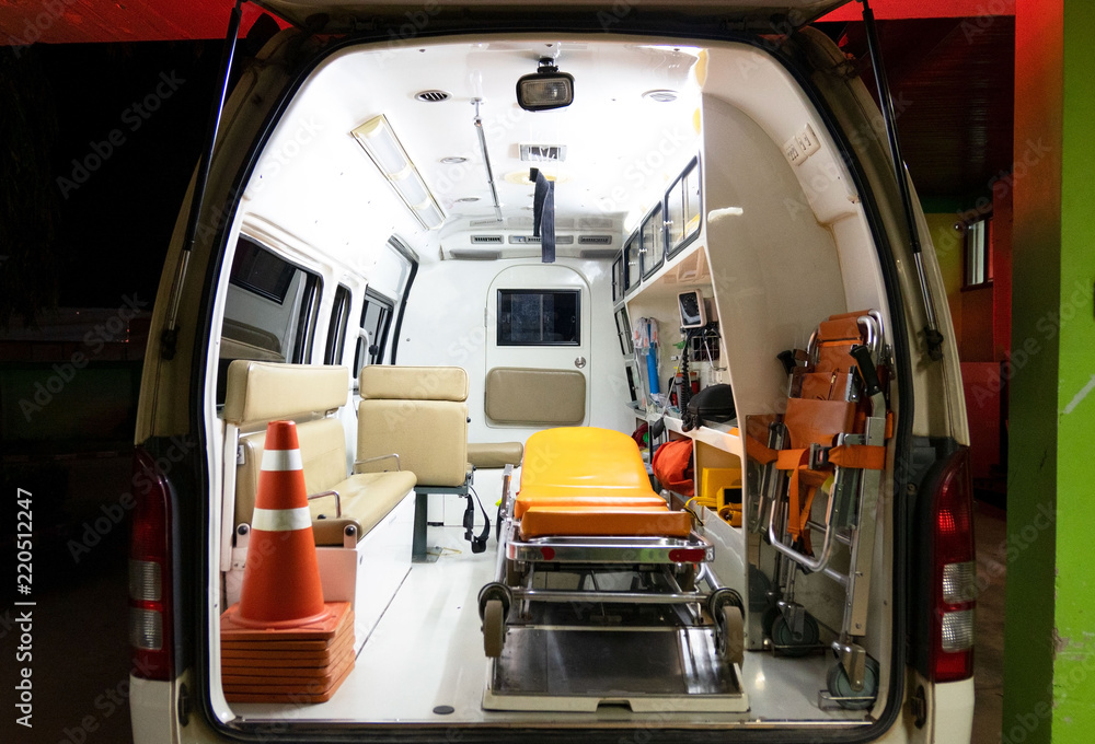Inside an ambulance with medical equipment . Car for patient refer ...