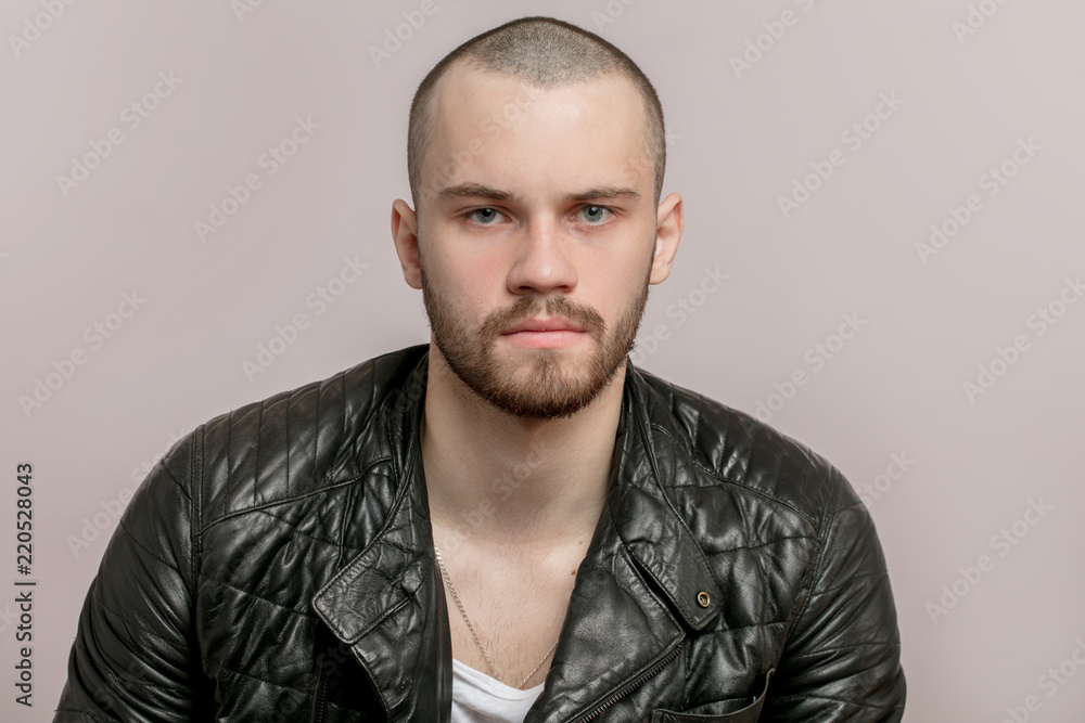 tired bodybuilder in fashion clothes looking ath the camera isoalted ...