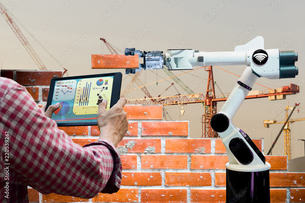 Man holding a tablet Remote control Smart robot industry 4.0 arm brick ...