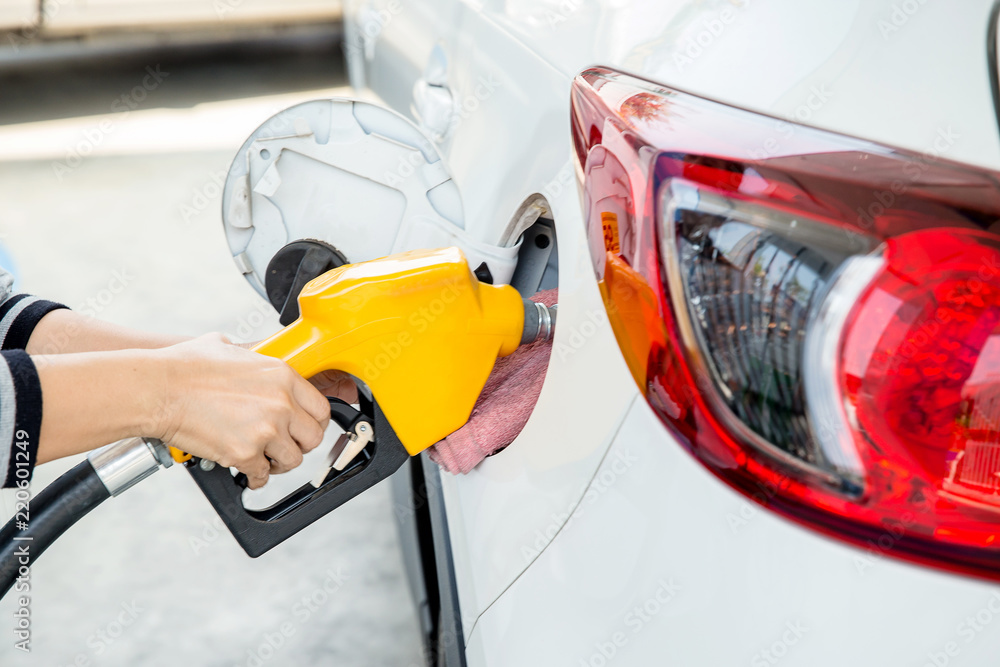 Man Refill and filling Oil Gas Fuel at station.Gas station - refueling ...