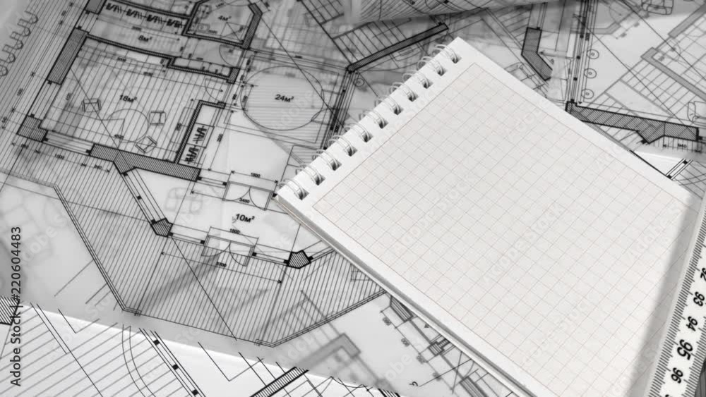 workplace of the architect: rolls of blueprints, notepad, yardstick ...