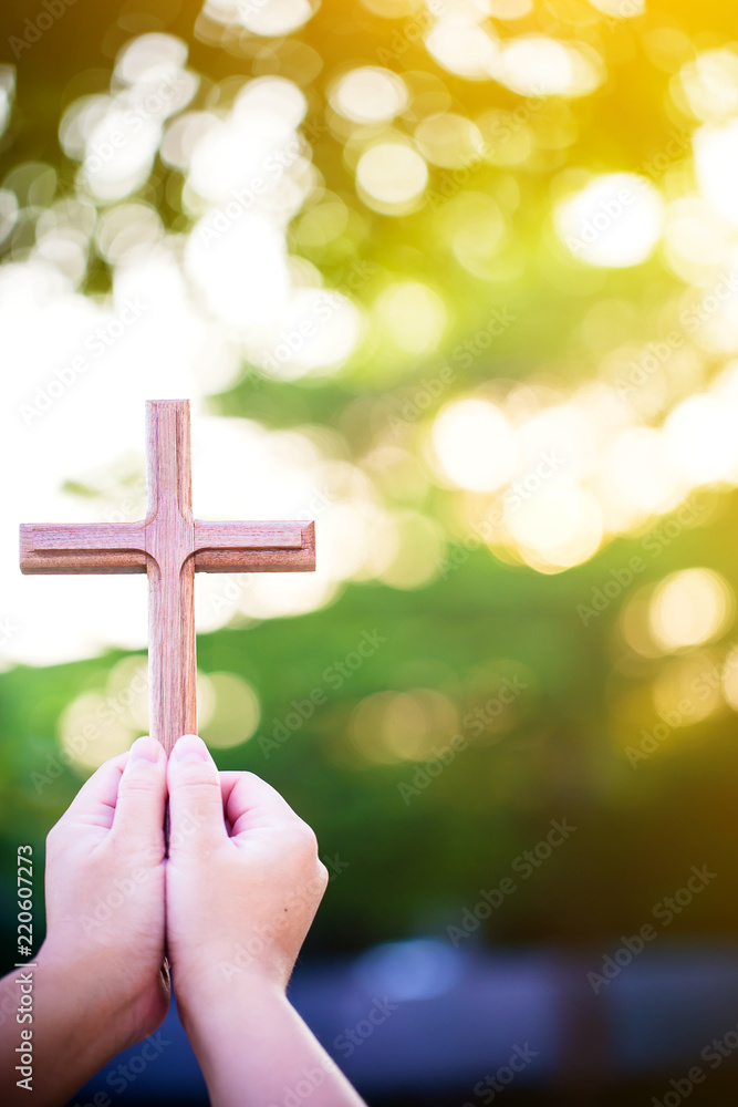 person palm hands to hold holy cross, crucifix to worship. christian in ...