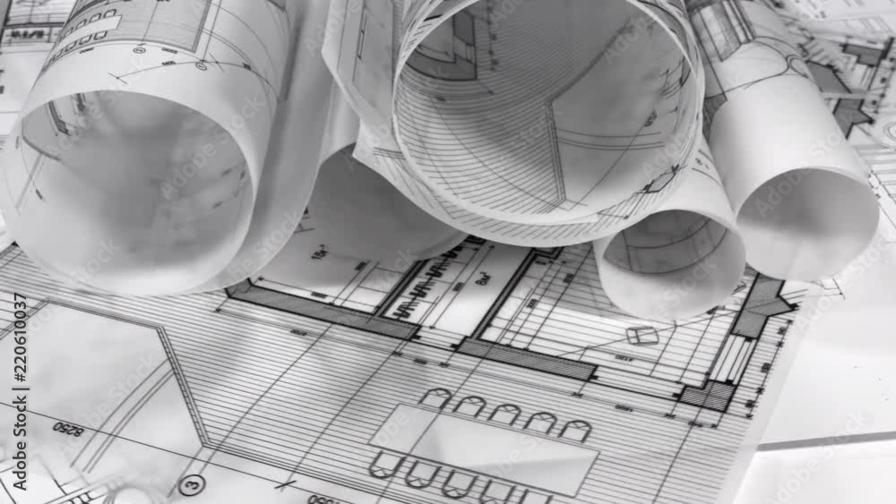 Blueprints - rolls of architectural drawings smoothly rotate on the ...